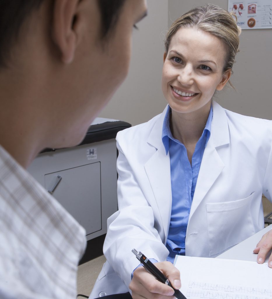 Doctor with patient - Next Steps in Dermatology